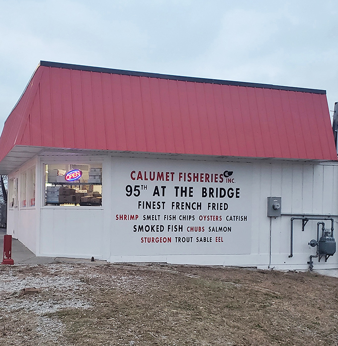The iconic red-roofed shack by the 95th Street Bridge stands as a beacon of smoked seafood perfection in Chicago's southeastern corner.