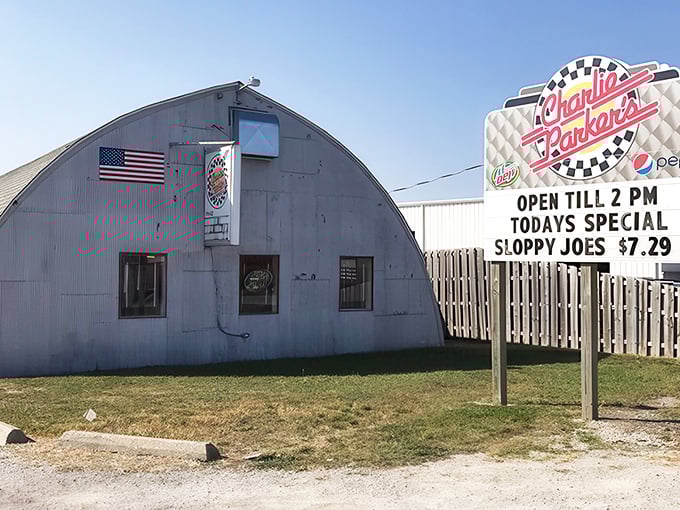 The iconic Quonset hut exterior of Charlie Parker's stands like a silver time capsule, promising nostalgic delights within its curved metal walls.