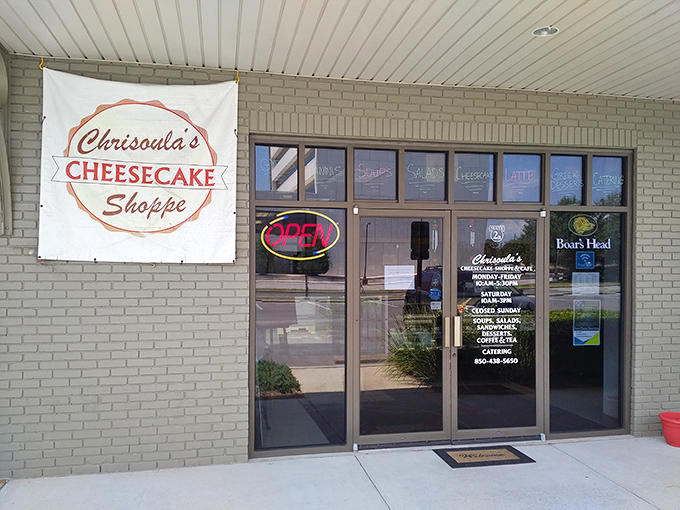 The unassuming storefront of Chrisoula's Cheesecake Shoppe beckons with its simple sign and neon "OPEN" light &ndash; a modest gateway to cheesecake paradise.