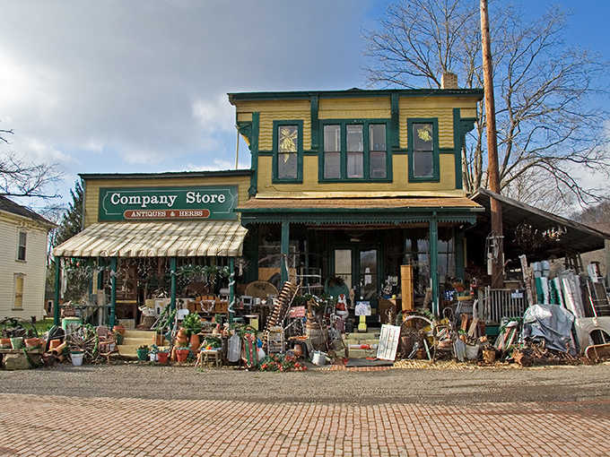 The iconic yellow facade of Company Store Antiques beckons with promises of treasures within, its weathered charm a prelude to the wonders inside.