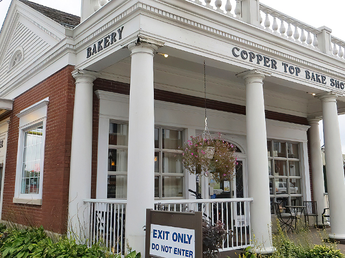 Copper Top Bake Shop stands regally with its white columns and brick facade, like a temple dedicated to the worship of carbohydrates.