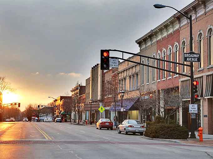 Sunset bathes Urbana's historic downtown in golden light, where brick buildings stand as silent witnesses to generations of small-town American life.