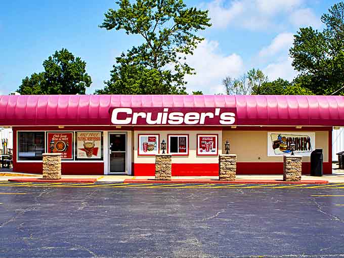 The iconic pink awning of Cruiser's beckons hungry travelers like a neon promise of deliciousness ahead. Fast food royalty in an unassuming package.