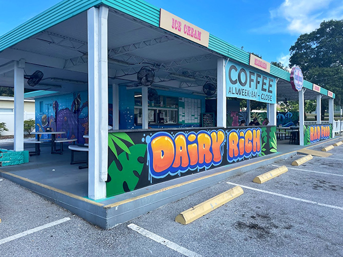 Dairy Rich's vibrant turquoise exterior pops against the Florida sky, promising "RAD FOOD" that actually delivers on the bold claim.