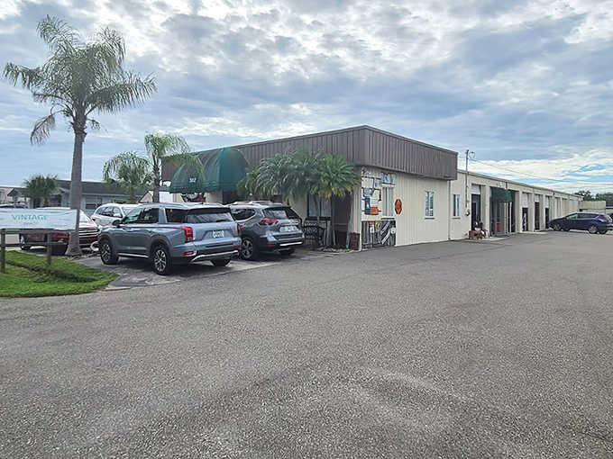 The unassuming exterior of Decades Reclaimed Vintage Depot hides a wonderland of treasures within, like a book you can't judge by its cover.