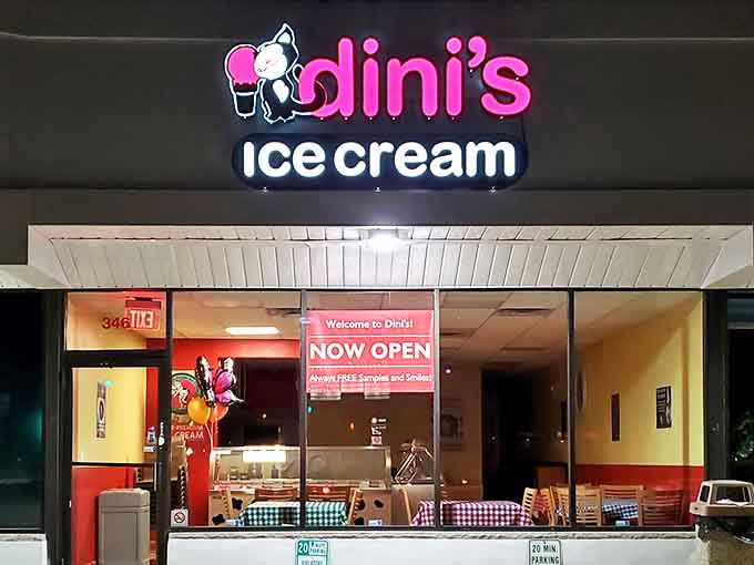 Dini's Ice Cream's neon sign glows like a beacon of sweet promises against the night sky, beckoning dessert lovers from across Roselle.