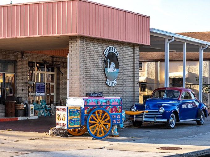 The iconic storefront of Dixieland Relics welcomes treasure hunters with its vintage blue truck and colorful painted cart &ndash; a prelude to wonders within.