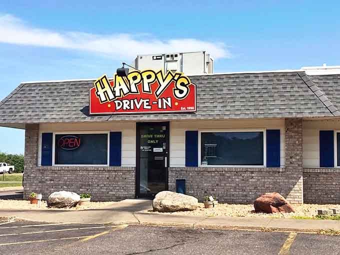 The cheerful Happy's Drive-In sign promises a journey back to simpler times when calories didn't count and milkshakes ruled supreme.