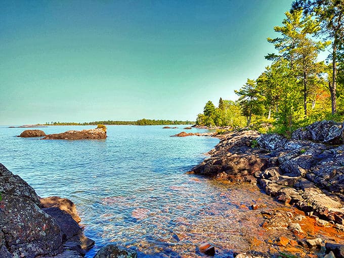 Esrey Park's pristine shoreline beckons with crystal-clear waters and ancient rock formations, nature's perfect playground for the soul.