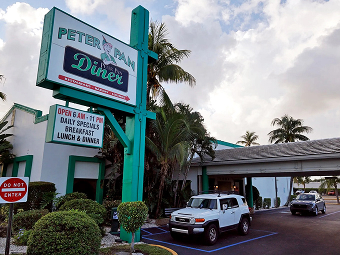 The iconic turquoise sign beckons like a beacon of breakfast hope on North Dixie Highway. Florida's morning sunshine makes it impossible to miss.