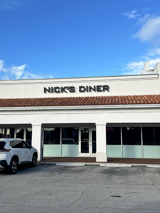 Nick's Diner exterior gleams under Florida sunshine, its classic signage promising a journey back to simpler, more delicious times.