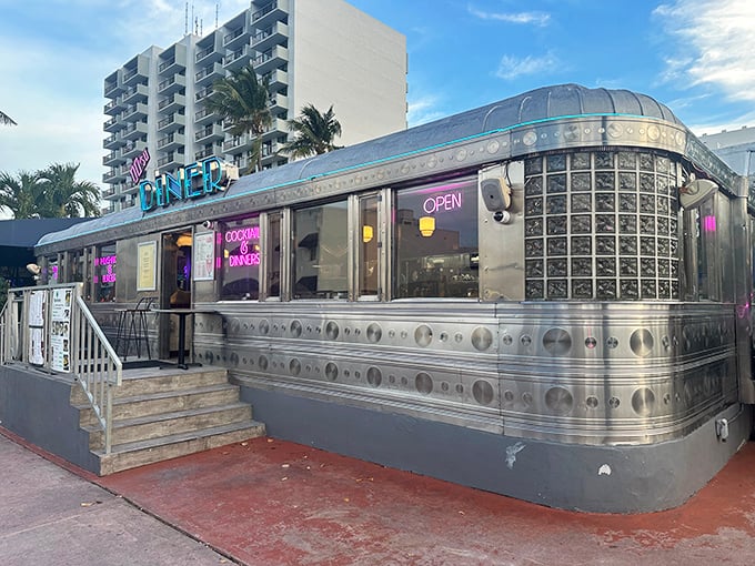 A gleaming silver time capsule on Miami Beach's 11th Street, this classic diner car shines like a beacon of nostalgia against the Florida sky.