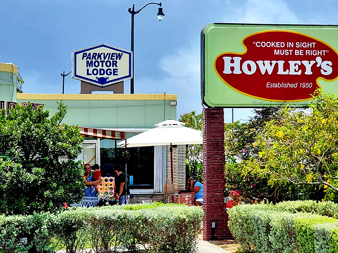 The iconic Howley's sign stands proudly next to Parkview Motor Lodge, a mint-green beacon of culinary nostalgia since 1950.