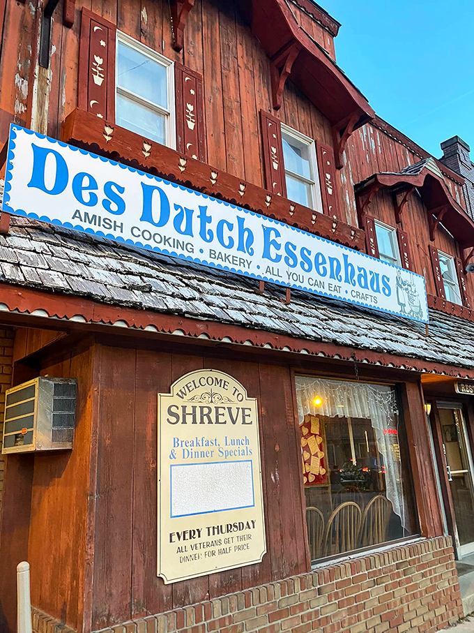 The weathered wooden exterior of Des Dutch Essenhaus stands like a time capsule of flavor, promising Amish cooking that'll make your taste buds dance with joy.