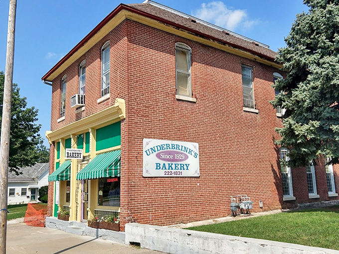 The iconic brick exterior of Underbrink's Bakery stands proudly on College Avenue, its green storefront and yellow awnings beckoning sweet-toothed pilgrims since 1929.