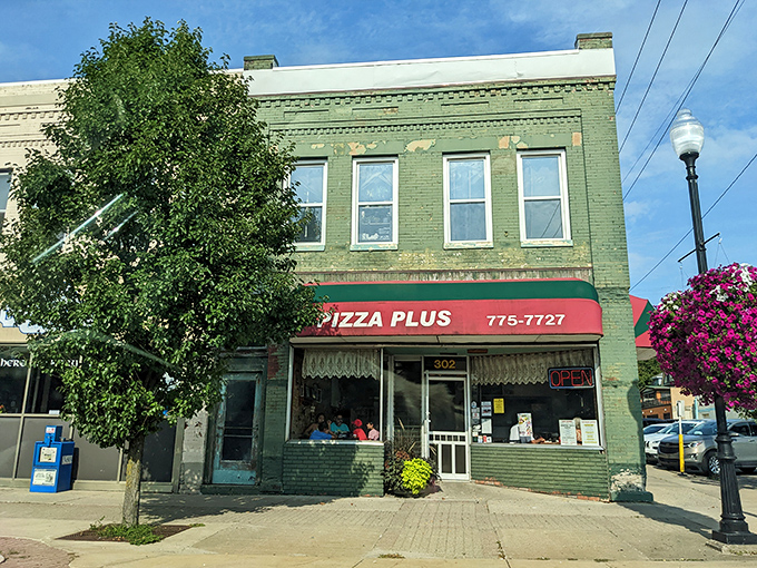 A slice of small-town Americana: Pizza Plus's modest green-brick exterior hides flavor treasures that would make any foodie weak at the knees.