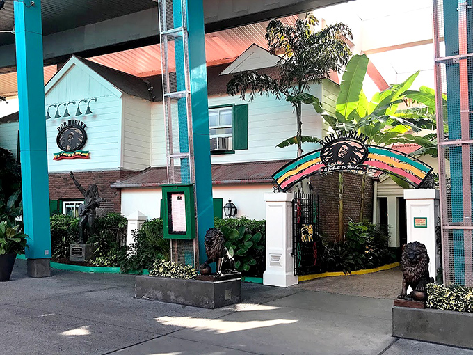 A tropical oasis amid Orlando's attractions, the white facade and vibrant rainbow archway promise an authentic Jamaican escape from the moment you arrive.
