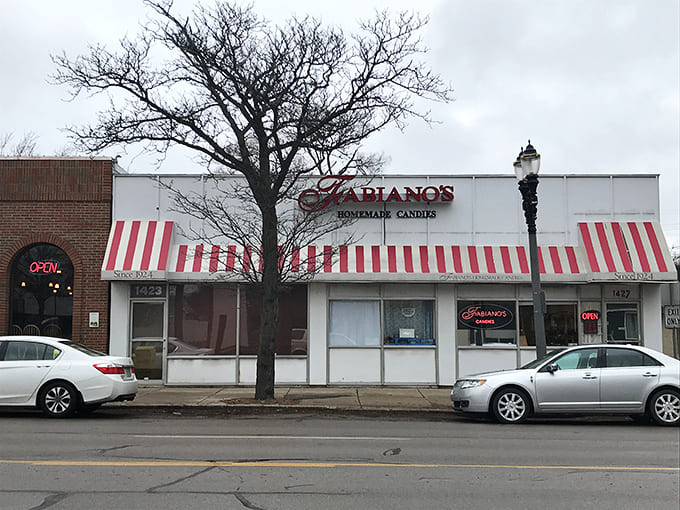 Those candy-cane striped awnings aren't just charming; they're a beacon for anyone within a three-block radius who suddenly realizes they need chocolate immediately.