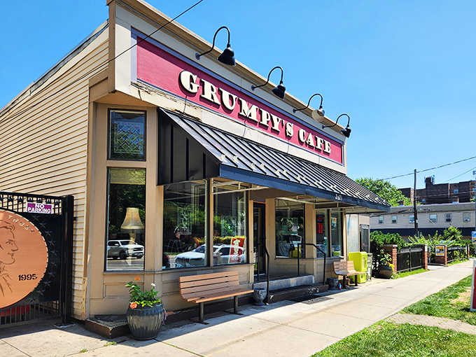 The welcoming facade of Grumpy's Cafe stands proudly on West 14th Street, its bright red sign promising delicious adventures within.