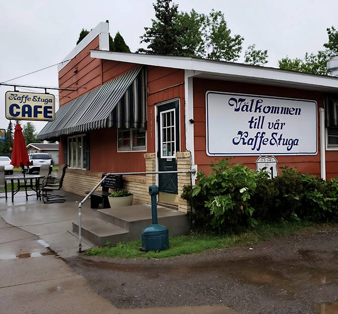 The welcoming red exterior of Kaffe Stuga Café stands as a roadside beacon of comfort food, promising Swedish-American delights inside.