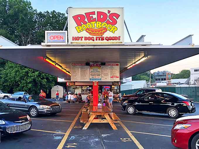Red's Root Beer stands proudly in Paw Paw, Michigan, its vintage sign glowing like a beacon for hungry travelers seeking a taste of nostalgic Americana.