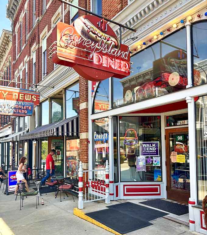 The iconic red and white exterior of Coney Island Diner stands proudly on Mansfield's main street, its vintage sign promising comfort and nostalgia to all who enter.