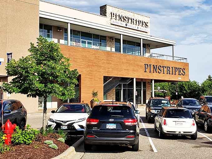 Pinstripes' modern exterior blends warm wood and stone, promising an experience far beyond your typical bowling alley expectations.