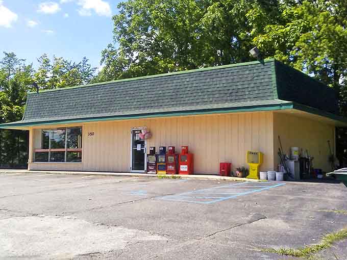 Exterior: Unassuming yellow building with a green roof, Max's Donuts stands like a humble guardian of sweetness on Genesee Street in Lapeer.