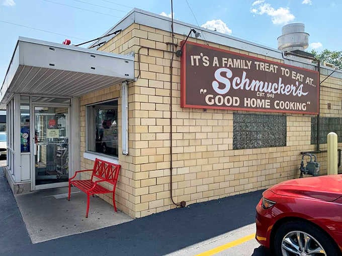 The iconic yellow-brick exterior of Schmucker's, where time has stood still since 1948, promising homestyle goodness inside.