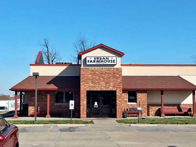 The welcoming brick facade of Urban Farmhouse beckons hungry travelers like a lighthouse for comfort food seekers in Highland's sea of cornfields.
