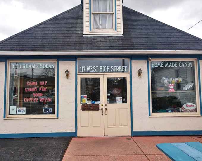The charming blue-trimmed cottage at 117 West High Street stands as a sweet beacon in Circleville, promising homemade candy and ice cream delights within its welcoming doors.