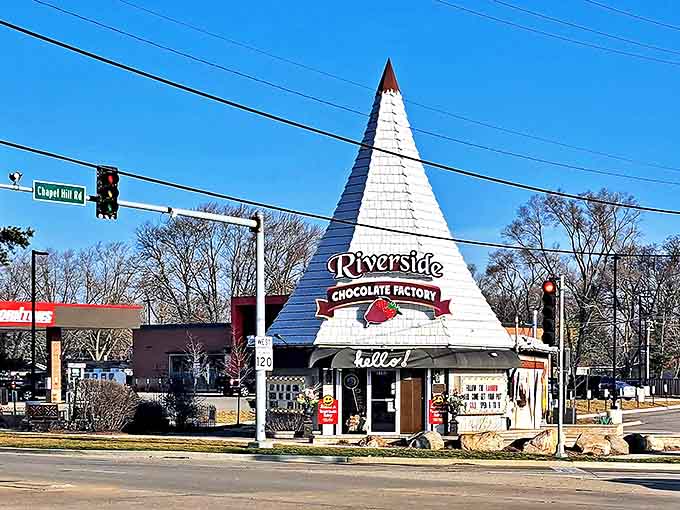The iconic white pyramid structure of Riverside Chocolate Factory stands out on the corner of Chapel Hill Road in McHenry, Illinois.