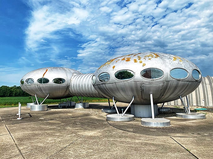 The Futuro House stands like a silver sentinel in the Ohio countryside, its metallic sheen catching sunlight like a beacon from another world.