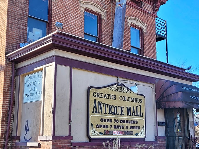 The stately brick facade of Greater Columbus Antique Mall beckons with promises of vintage treasures and the thrill of discovery behind those wooden doors.