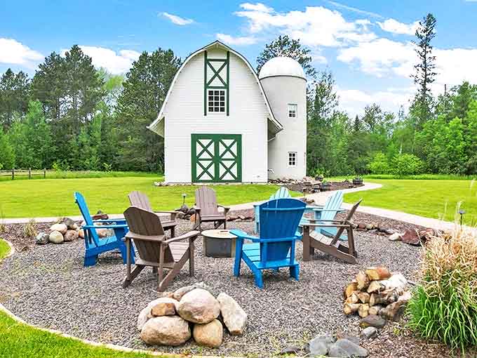 The iconic white barn with green trim stands proudly against Minnesota's blue sky, promising a countryside escape that's anything but ordinary.