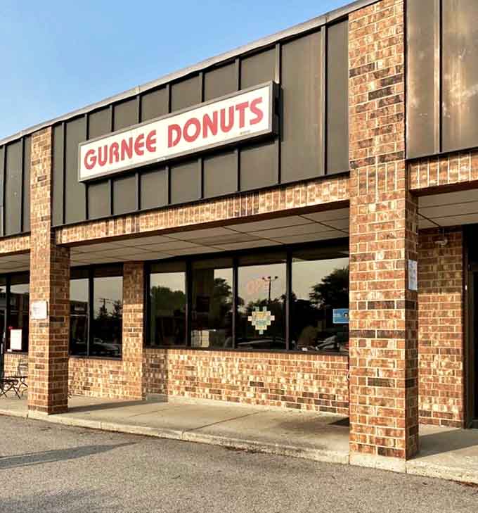 The unassuming brick fa&ccedil;ade of Gurnee Donuts hides a purple paradise within &ndash; proof that culinary magic often happens in the most modest settings.