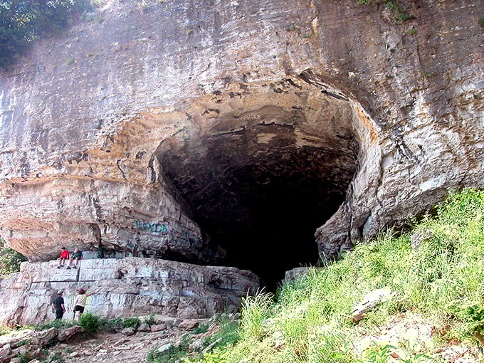 Nature's grand entrance: The massive Cave-In-Rock beckons adventurers with its gaping maw carved by centuries of persistent water and time.