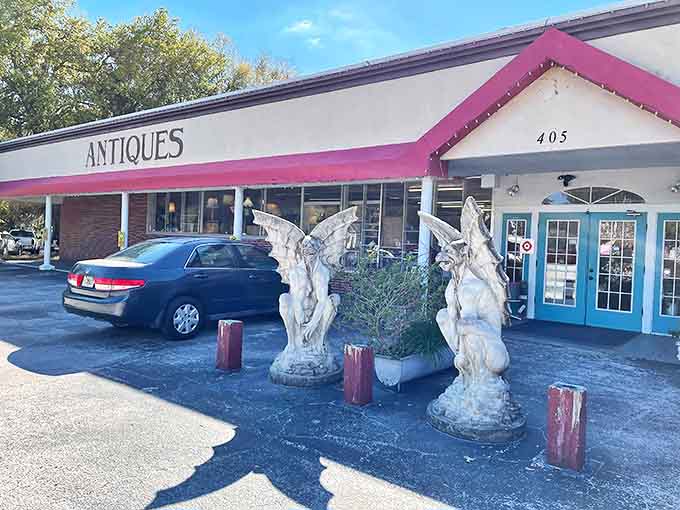 That pink awning isn't just cheerful, it's practically hollering "treasures inside!" while those guardian angels stand watch over decades of stories waiting to be discovered.