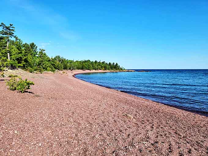 Hunter's Point Park: A pristine shoreline where Lake Superior's crystal-clear waters meet a beach of colorful pebbles polished by centuries of gentle waves.