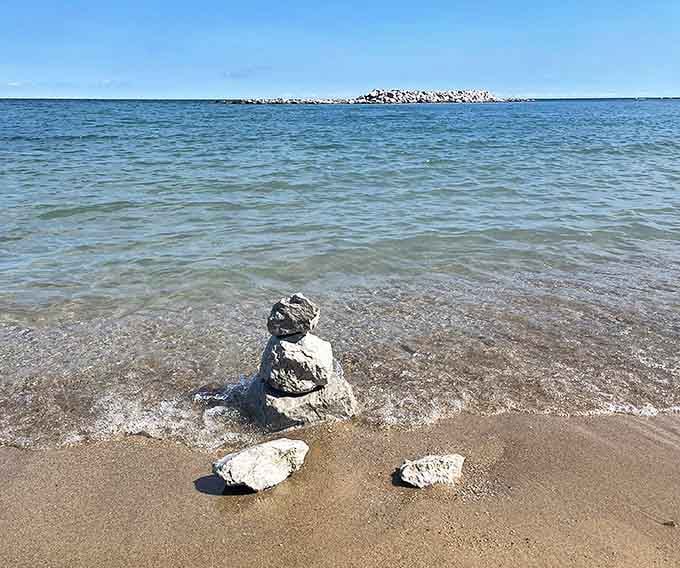 Nature's perfect illusion: Lake Michigan stretches endlessly at Illinois Beach State Park, convincing even seasoned travelers they've found an ocean in the Midwest.