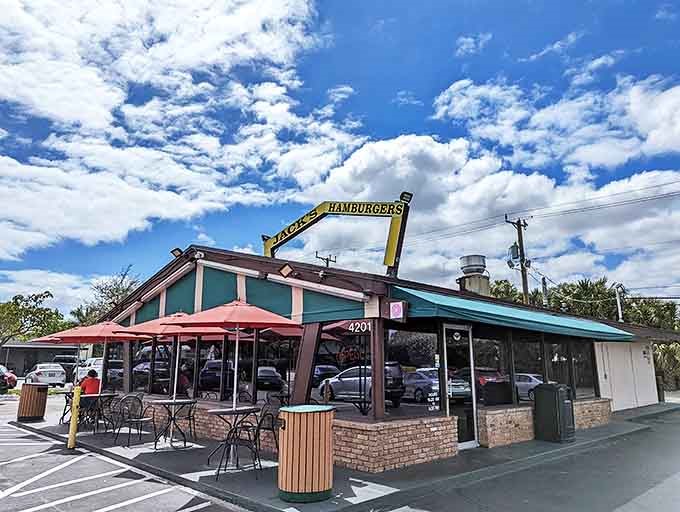 Under Florida's brilliant blue sky, Jack's yellow sign has been beckoning burger lovers to this unassuming roadside haven since 1972.