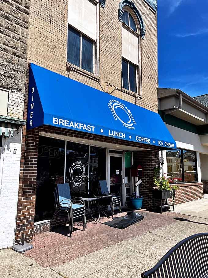 That blue awning isn't just a canopy, it's a portal to flavor paradise where breakfast dreams come true and calories don't count.
