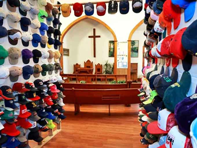 A divine collection of headwear fills this former church in Forrest, Illinois, where baseball caps have replaced hymns and prayers.