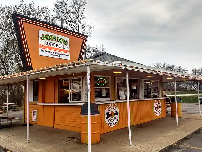 The iconic orange exterior of John's Root Beer stands out like a beacon of nostalgia in Waukesha, promising authentic American comfort food since 1937.