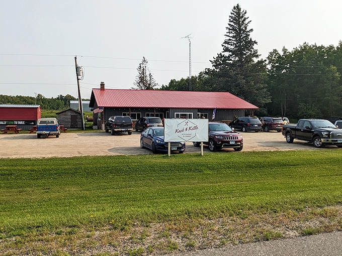 The unassuming exterior of Knob & Kettle beckons hungry travelers with its bright red roof, standing like a culinary lighthouse in Laporte's wilderness.