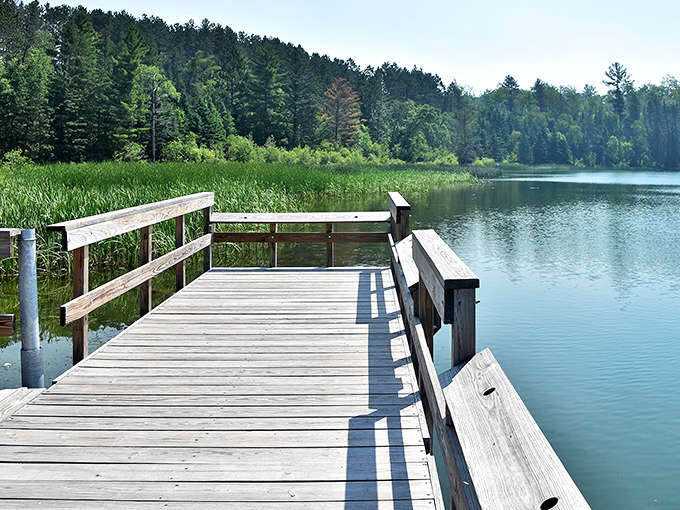 A wooden dock extends into the tranquil waters of La Salle Lake, where time seems to slow down and worries drift away with the gentle ripples.