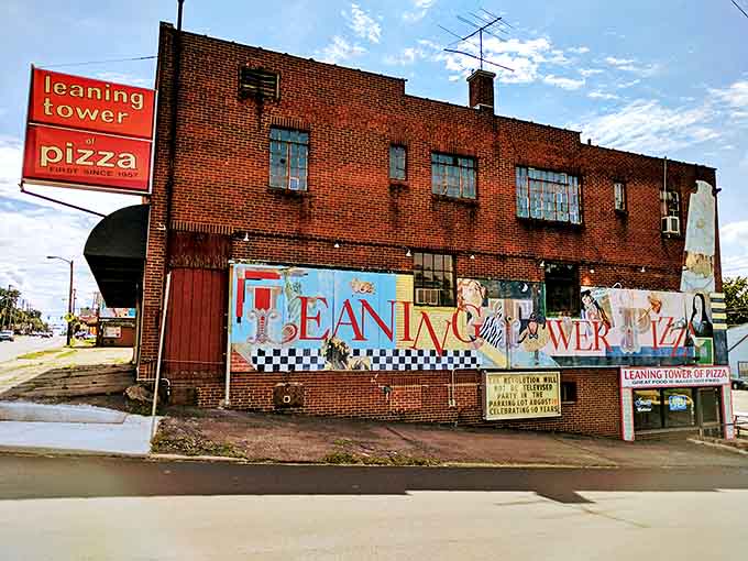 The iconic brick exterior of Leaning Tower of Pizza stands proudly on Lexington Avenue, its vintage sign a beacon for hungry Mansfield locals.