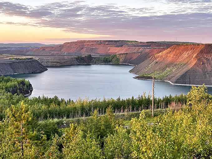 Sunset bathes the Leonidas Overlook in golden light, transforming mining's industrial scars into a landscape of surprising beauty and tranquility.