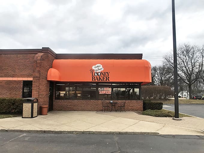 The iconic orange awning of The Looney Baker beckons from the roadside, promising sweet salvation for anyone with a functioning sweet tooth.
