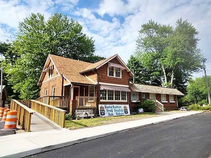A charming brick and cedar-shingled house transformed into pastry paradise – Harbert Swedish Bakery welcomes visitors with its distinctive red and white awnings.